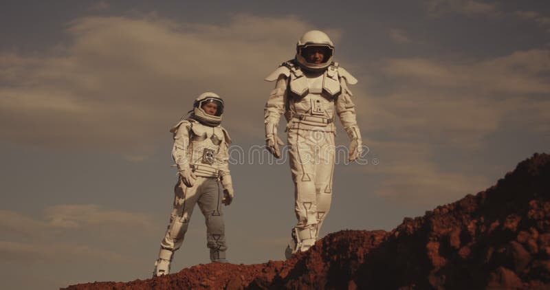 Two astronauts on Mars stock image. Image of futuristic - 153418771