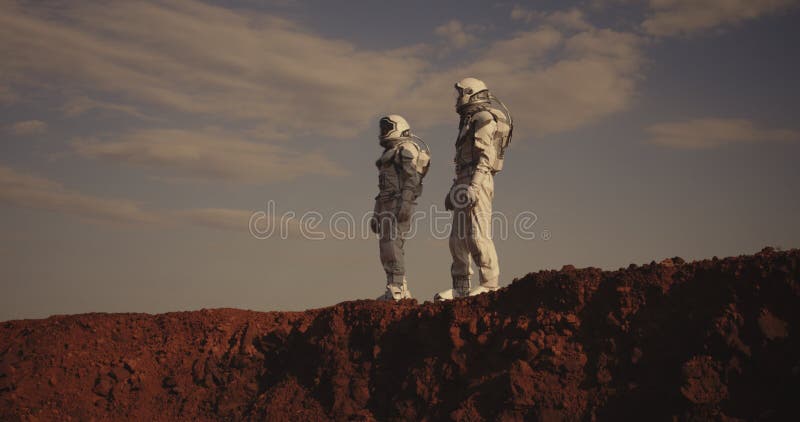 Two astronauts on Mars stock image. Image of outdoors - 153418779