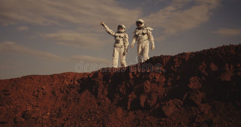 Two astronauts on Mars stock image. Image of scifi, pioneering - 153418829