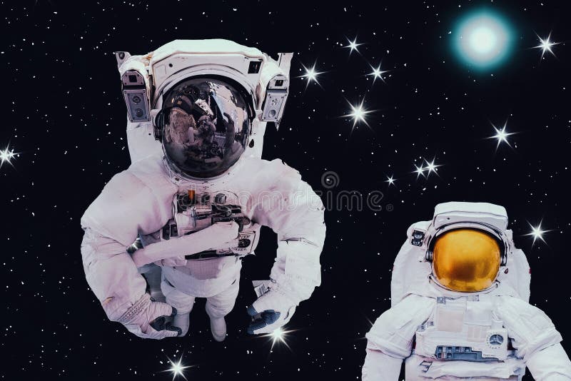 Two Astronauts are Posing in Outer Space. the Elements of this Image ...