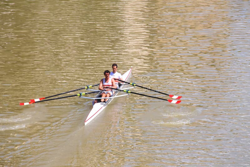Two Athletes in Academic Rowing Training on the River Arno Editorial ...