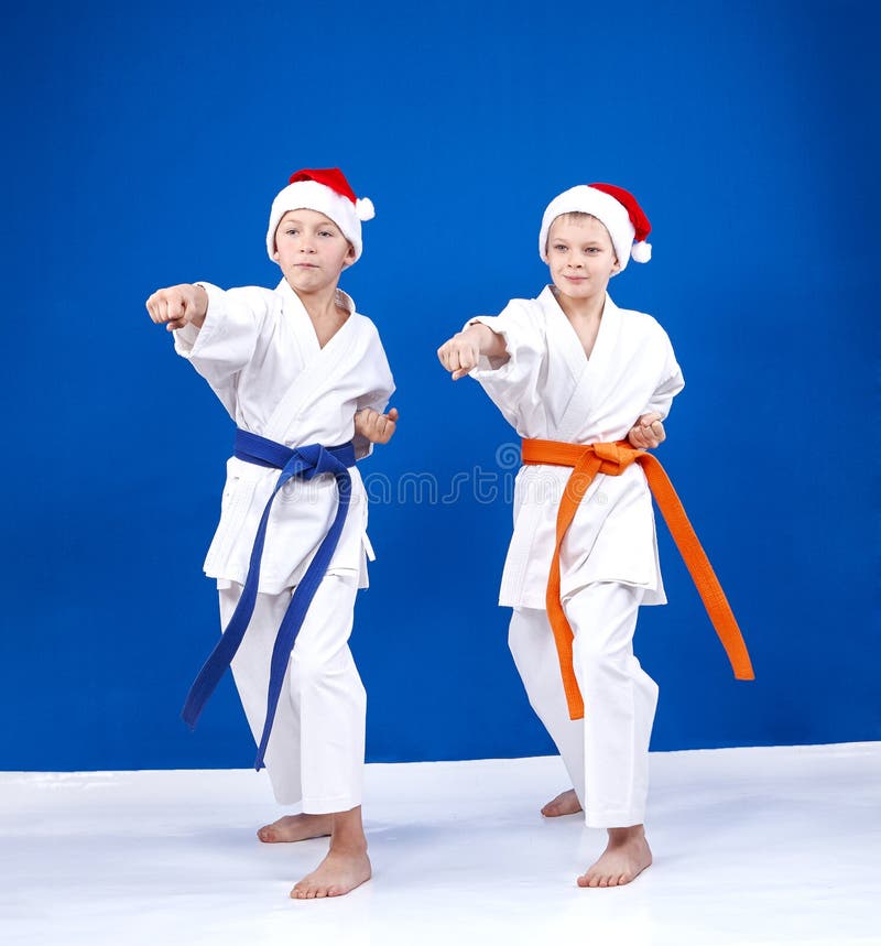 Two Athletes in Caps of Santa Claus Beats Punch Hand Stock Photo ...