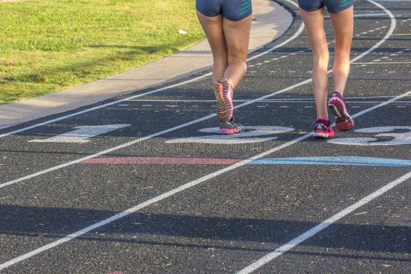 Two Athletes Running on a Track Stock Image - Image of feet ...
