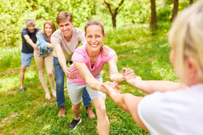 Two Athletic Teams Pull Hands Stock Image - Image of pull, outside ...