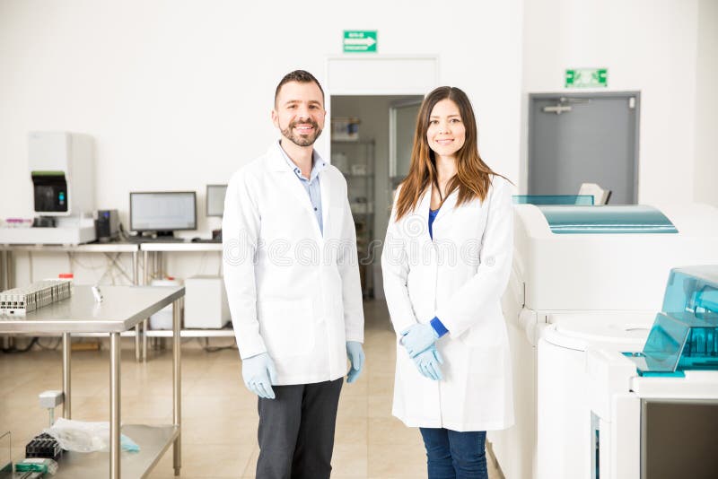 Two Attractive Chemists at Work Stock Image - Image of chemical ...