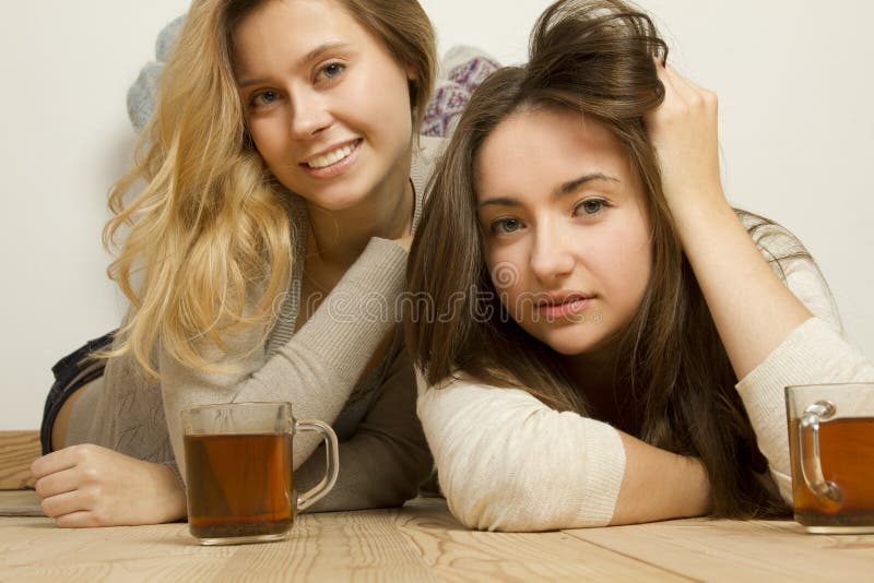 Two Attractive Friends Drinking Tea Stock Photo - Image of life, foot ...
