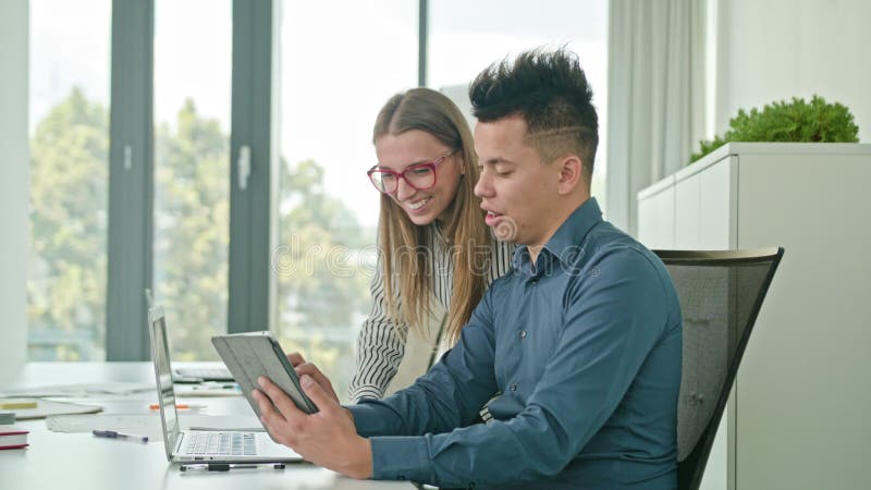 Two People Discussing Ideas Using Digital Tablet Stock Photo - Image of ...