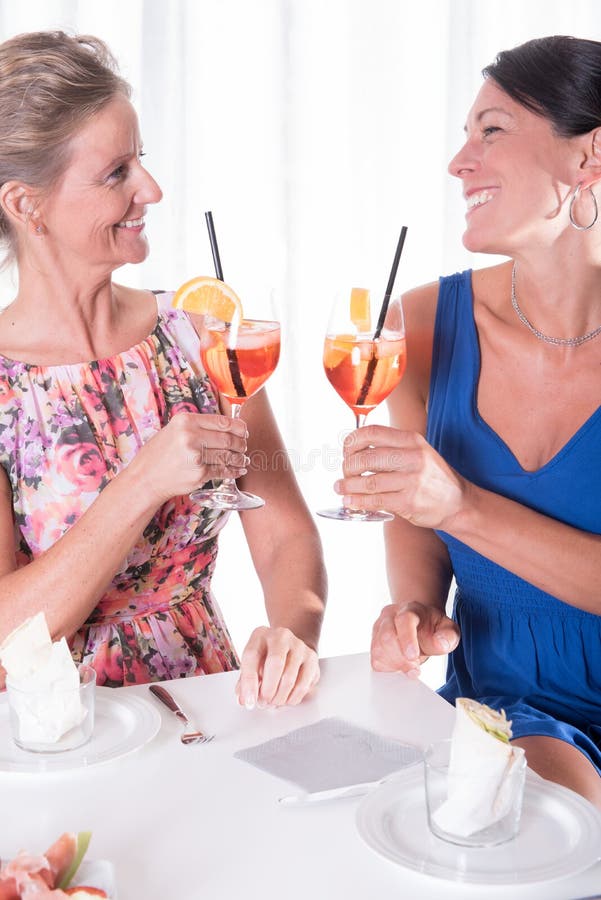 Two Attractive Women Having a Light Dinner Stock Photo - Image of light ...