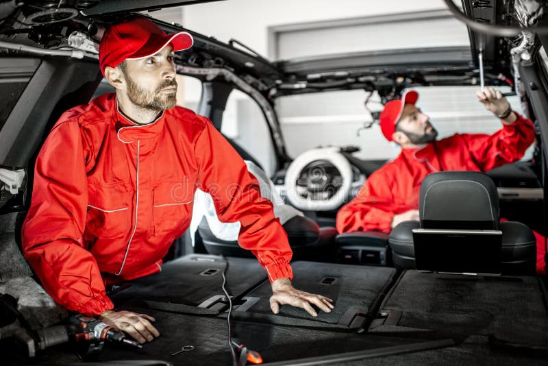 Car Service Workers with New Tires at the Shop Stock Image - Image of ...