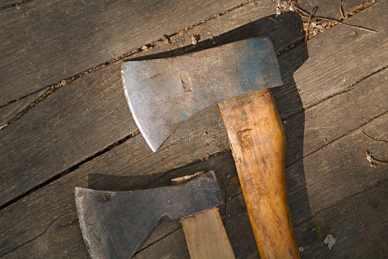 Two Axes on the ground stock image. Image of construction - 93363879