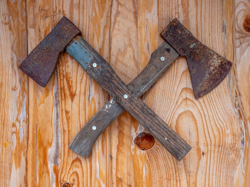Two axes on a wooden wall stock photo. Image of life - 248654434
