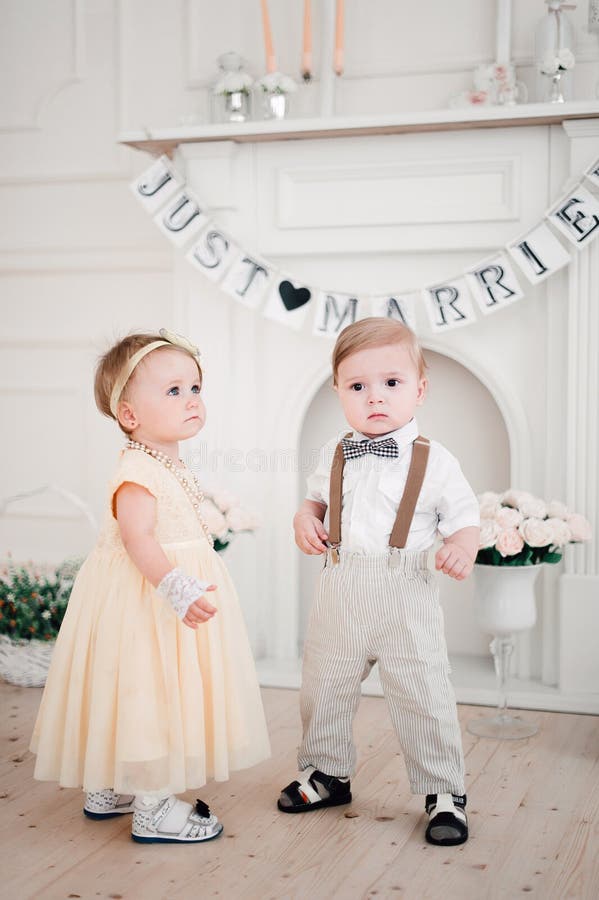 Two Babies Wedding - Boy and Girl Dressed As Bride and Groom Stock ...