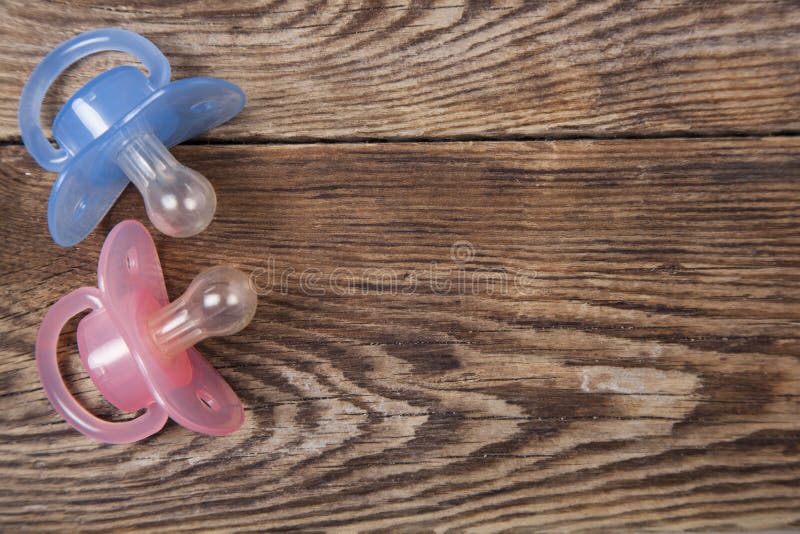 Two Baby Pacifier Red and Blue Stock Image - Image of comforter ...