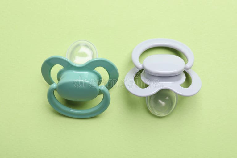 Two Baby Pacifiers on Pale Green Background Stock Photo - Image of ...