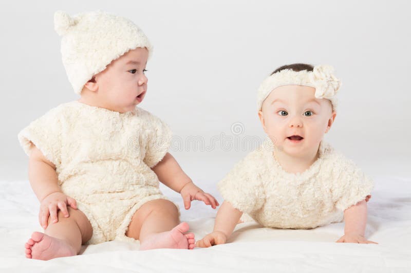 Two Baby in White Fur Dress in Stock Image - Image of little, classy ...