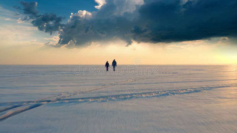 The Two Backpackers Trekking through the Icy Snow Field. Stock Image ...
