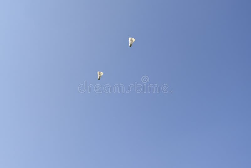 Two Badminton Balls Flying in the Blue Sky Stock Photo - Image of game ...