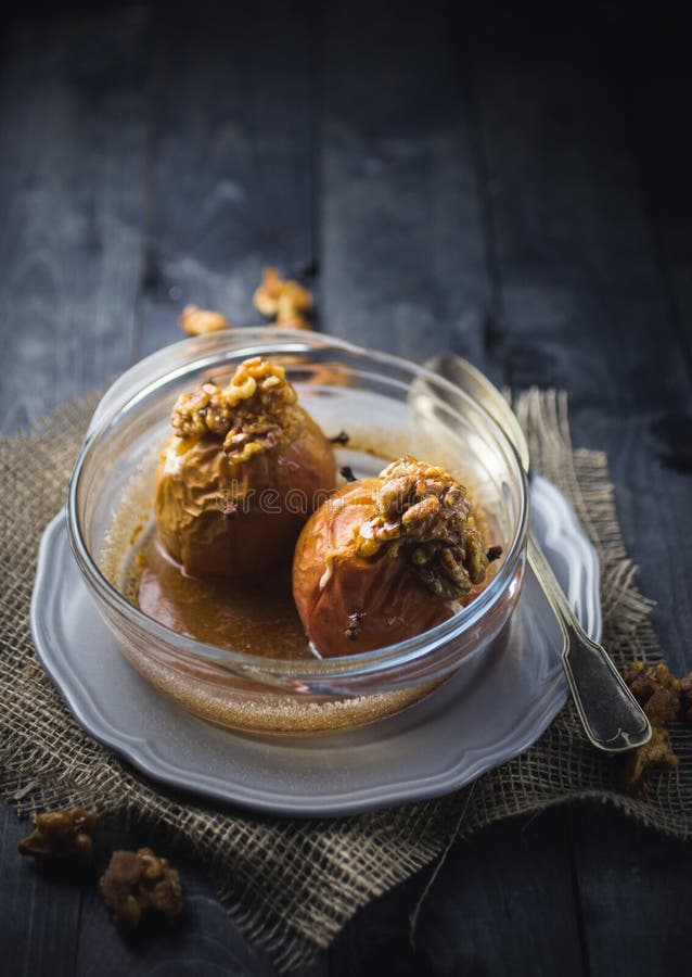 Baked Apples in a Glass Dish Topped with Marzipan and Nuts Stock Photo ...