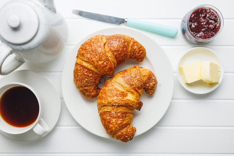Two Baked Tasty Croissants on Plate on White Table. Top View Stock ...