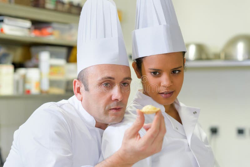 Two Bakers Looks at Pastries Stock Photo - Image of chefs, female ...