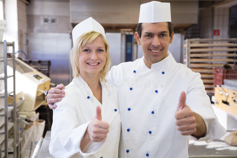Two Bakers Showing Thumbs Up in Bakeshop Stock Image - Image of kitchen ...