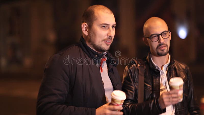 Two Bald Guys are Sitting in the Park and Eating Sandwiches and French ...