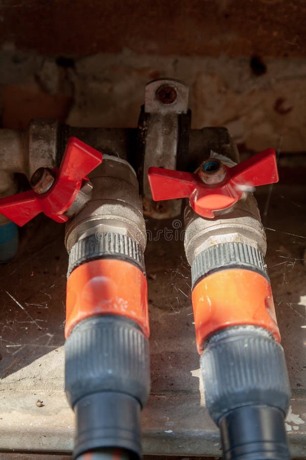Two Metal Taps with Water Hoses Close Up Stock Image - Image of ...