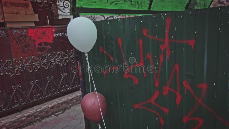 Two Balloons in Trash Dumpster. Party is Over Stock Video - Video of ...