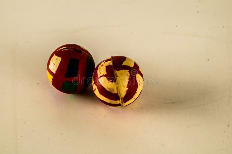 Two Balls with a Red and Yellow Design on Them Stock Photo - Image of ...