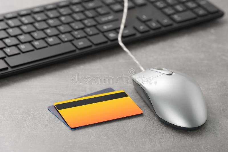 Two Bank Cards on a Table with a Computer Mouse and Keyboard. No People ...