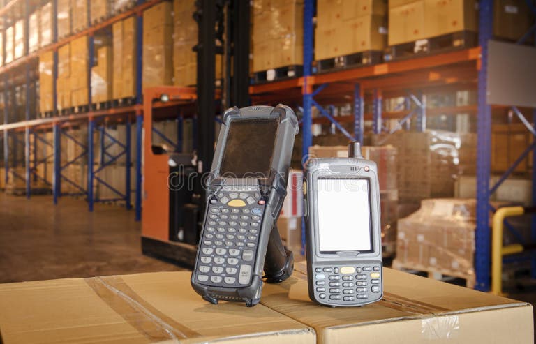 Two Bar Code Scanner on Package Boxes at Storage Warehouse. Computer ...