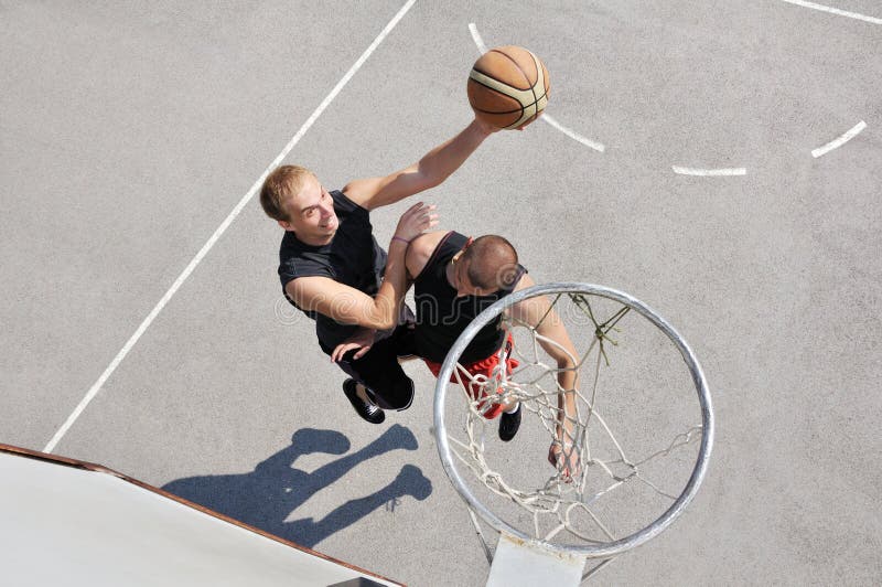 Two basketball players stock image. Image of healthy - 25676631