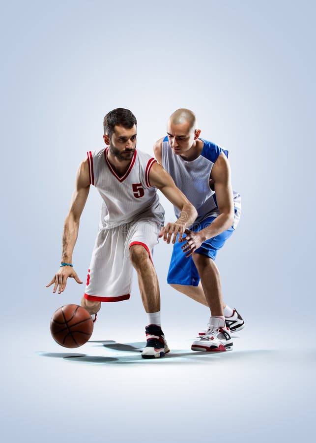 Two Basketball Players in Action Stock Image - Image of muscular ...