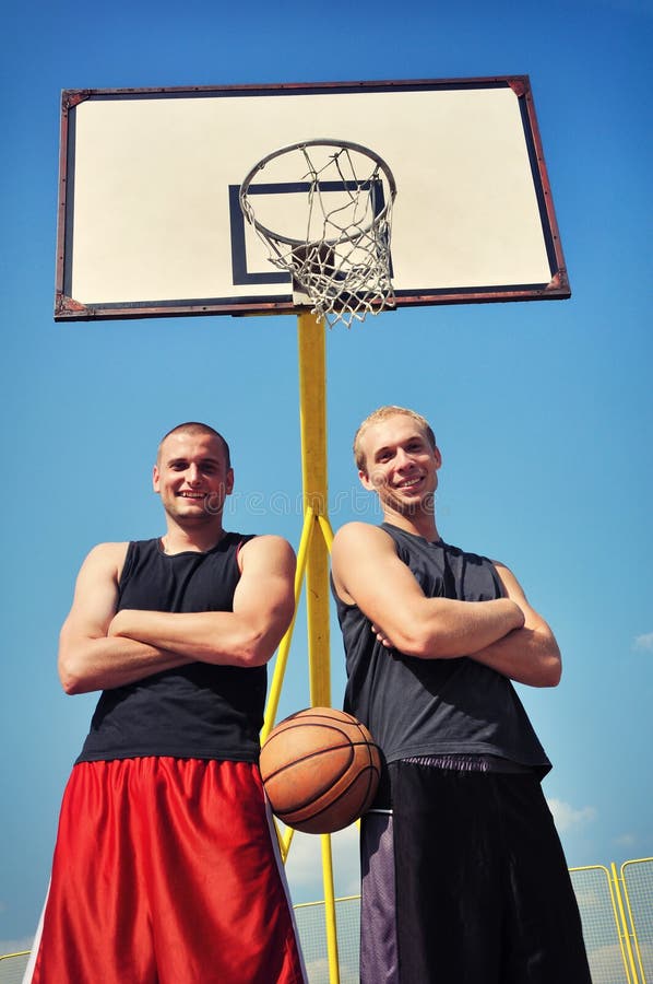 Two Basketball Players Smiling on the Court Stock Photo - Image of ...