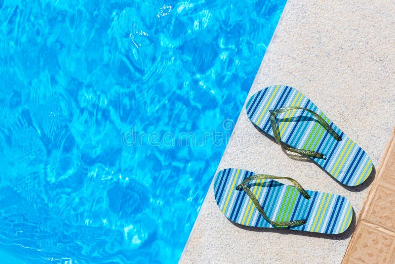 Two Bathing Slippers on Edge of Swimming Pool Stock Image - Image of ...