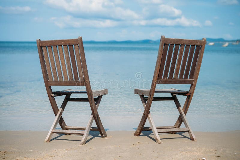 Two Beach Chairs on Tropical Shore Stock Image - Image of shore ...