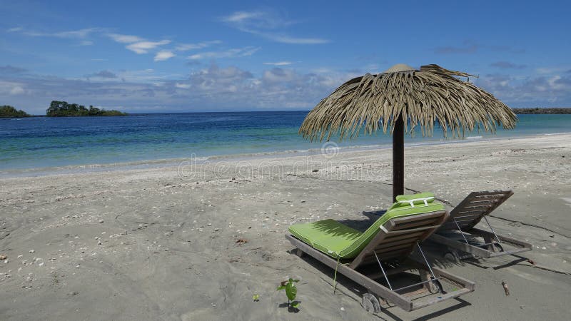 Two Beach Chairs and a Beach Umbrella Set Up on a Deserted Beach. Stock ...