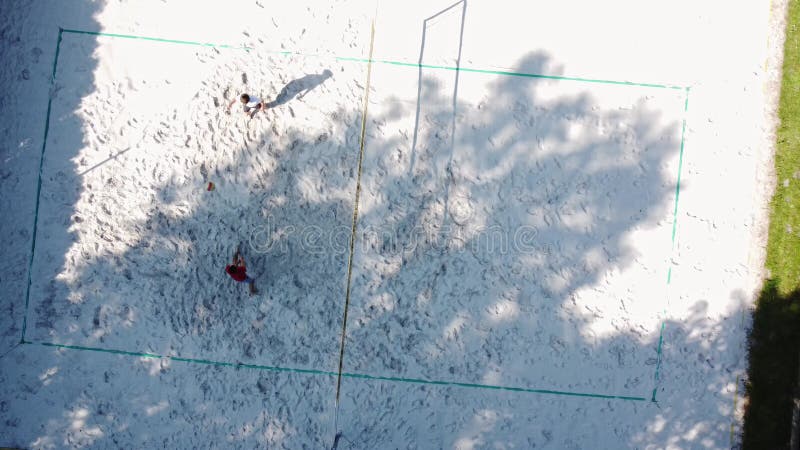 Two Beach Volleyball Players Practice Their Volleyball Skills As Part ... Two Beach Volleyball Players Practice Their Volleyball Skills As Part ...
