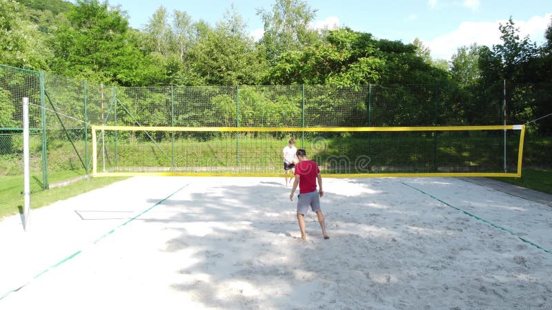 Two Beach Volleyball Players Practice Their Volleyball Skills As Part ... Two Beach Volleyball Players Practice Their Volleyball Skills As Part ...