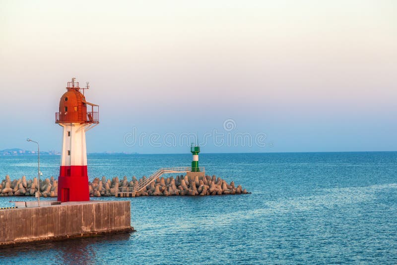 Two beacons stand on pier stock photo. Image of blue - 65964208