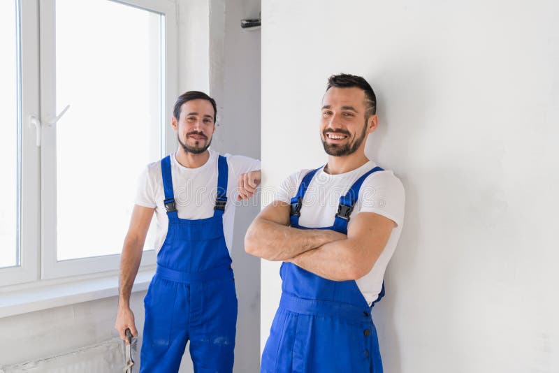 Two Foremen in Uniform Look at the Camera Stock Photo - Image of ...