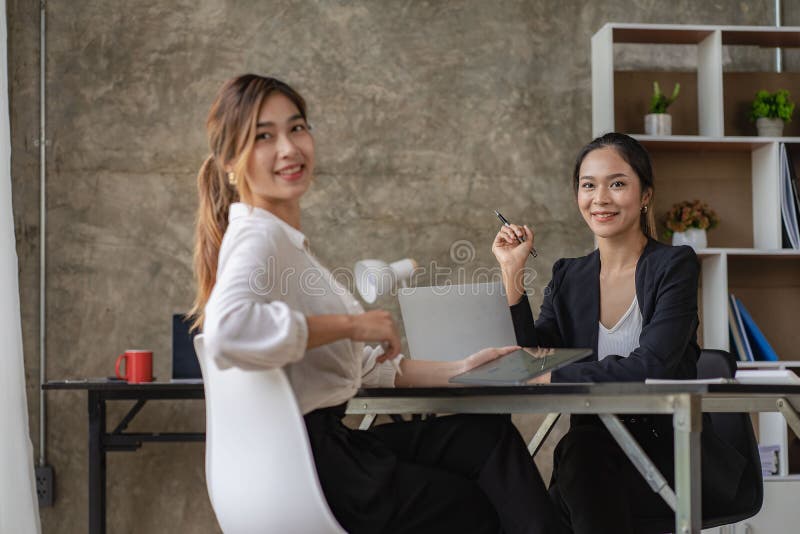 Two Beautiful Asian Women Discuss the Structure of Working Together ...