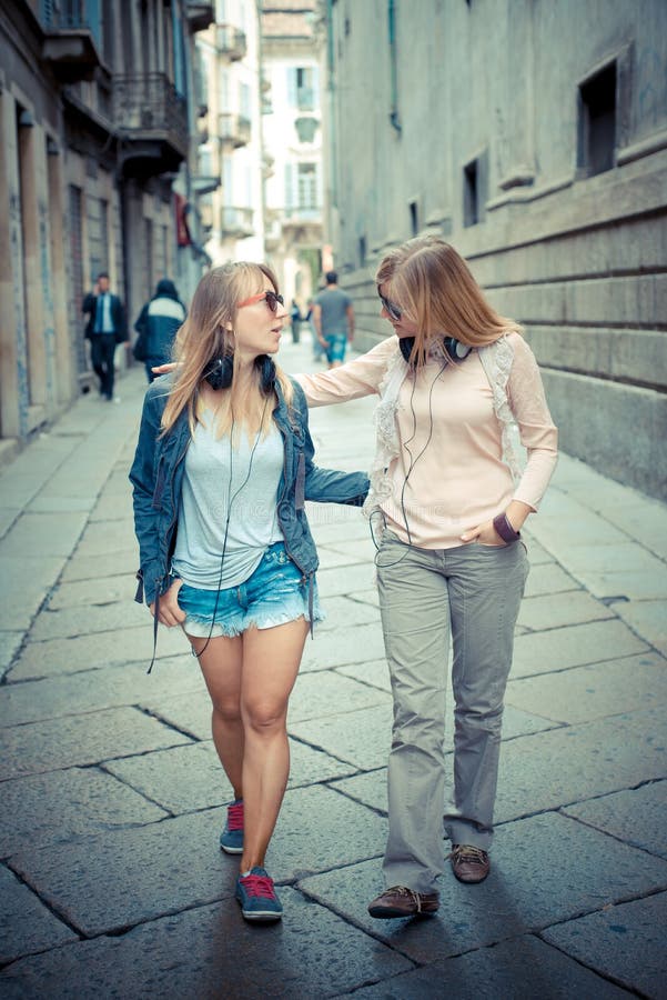 Two Beautiful Blonde Women Walking and Talking Stock Image - Image of ...