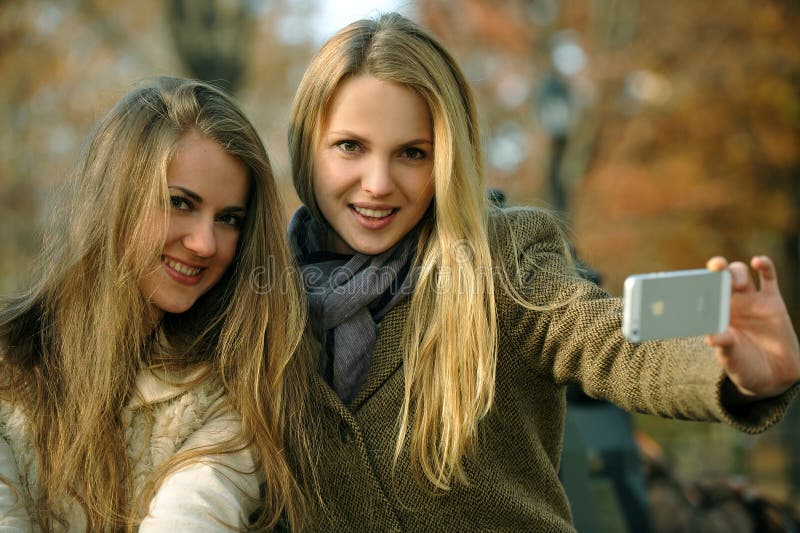 Two Beautiful Elegant Girls Shooting Themselves Stock Image Image Of