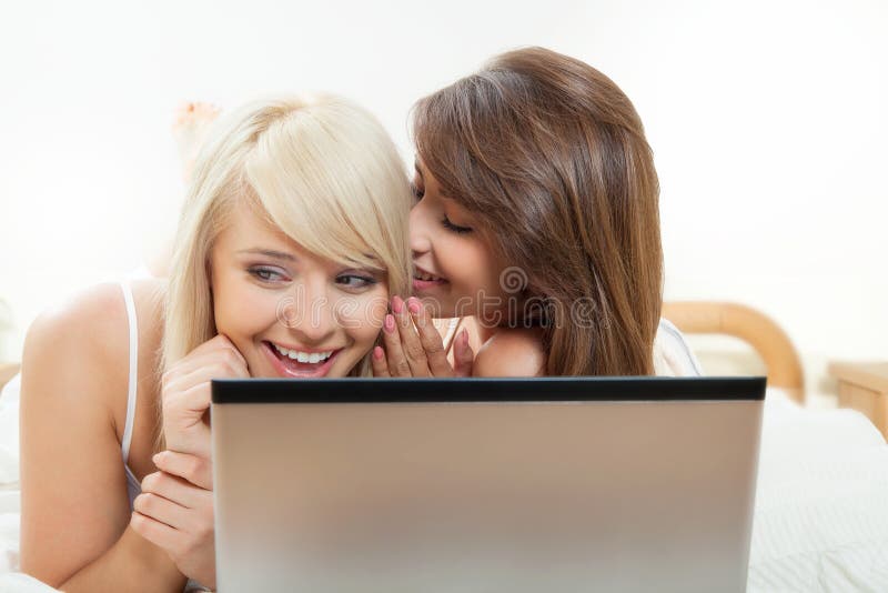 Two Beautiful Female Friends Gossiping Stock Photo - Image of computer ...