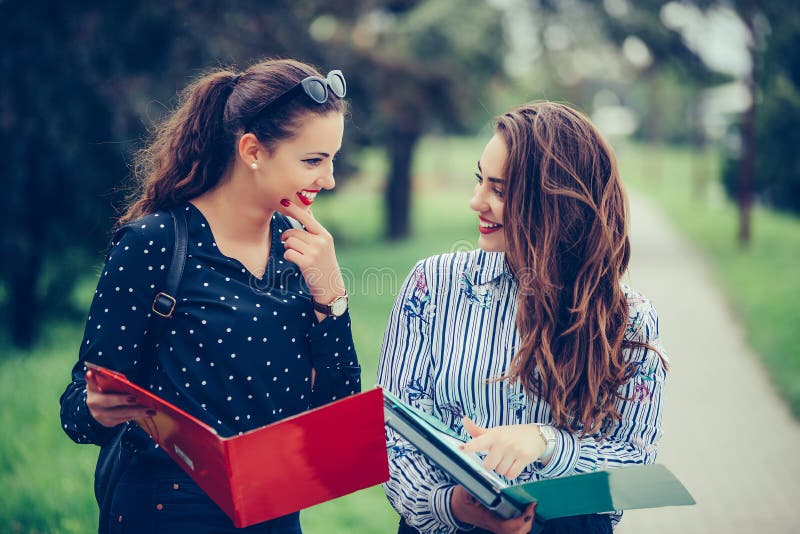 Two Beautiful Female Friends, Students Checking Paper Notes before Exam ...