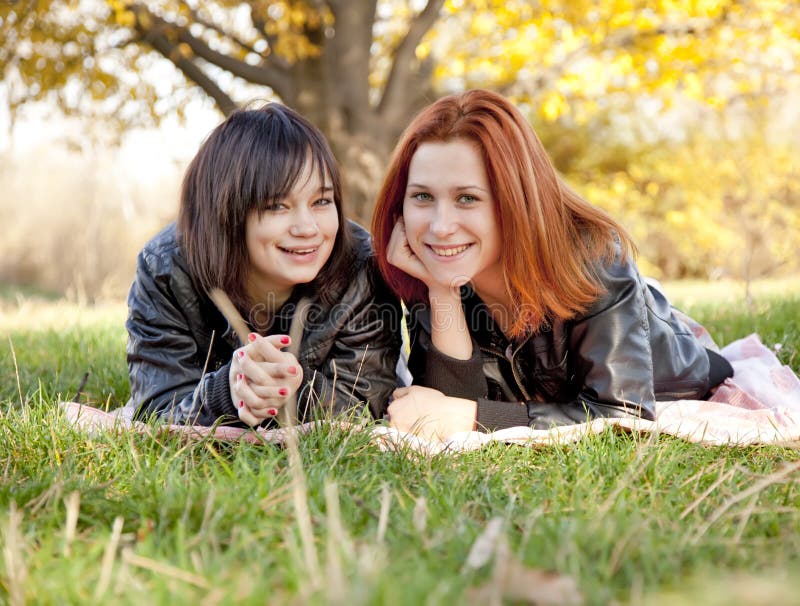Two Beautiful Girlfriends at the Autumn Park Stock Photo - Image of ...