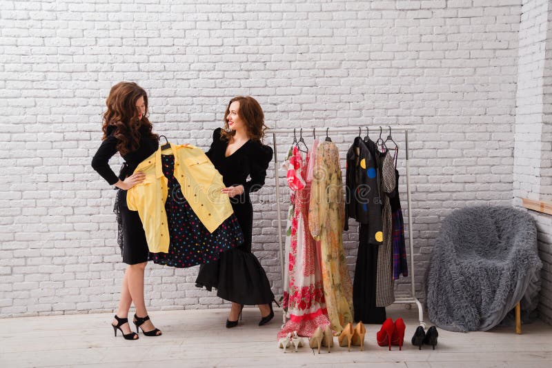 Two Beautiful Girls Choose Their Clothes for the Evening Stock Image ...