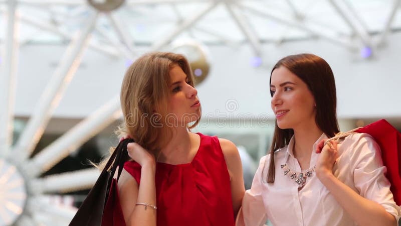 Two Beautiful Girls with Purchases Stand in Modern Stock Video - Video ...