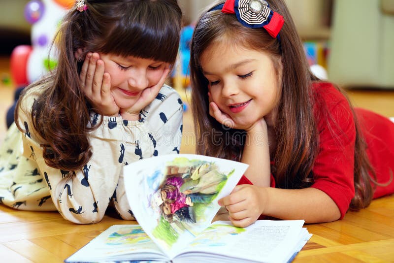 Two Beautiful Girls Reading Book at Home Stock Photo - Image of ...